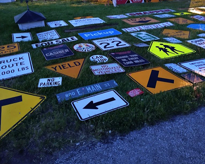 Street signs point in every direction at this vendor's patch of grass, offering authentic pieces of Americana that would make any man cave or game room instantly cooler.