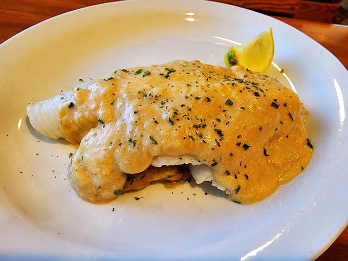 Stuffed flounder dressed up in lobster sauce like it's heading to the seafood prom.