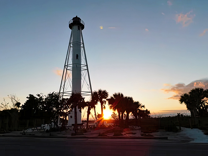 Magic hour transforms the lighthouse into a silhouette against a watercolor sky &ndash; Florida showing off its evening best.