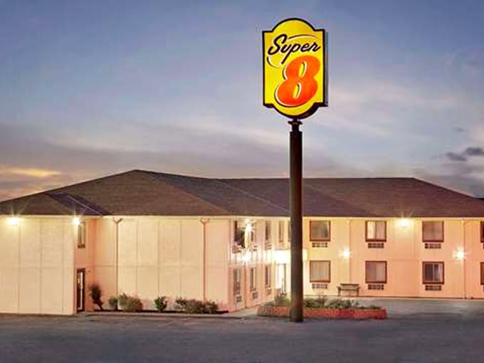 Even road-weary travelers find comfort at this welcoming Super 8, where the lights always shine bright against the twilight sky.