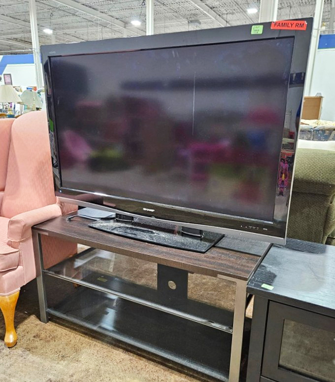 Entertainment center ready for its close-up. This flatscreen and stand combo costs less than what most people spend on streaming subscriptions in a year.