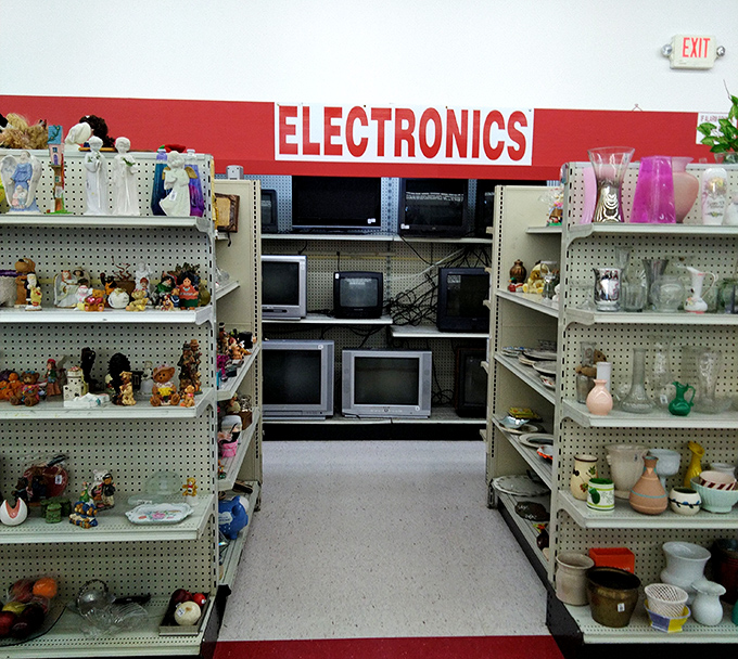 The electronics section: where vintage meets value. Surrounded by figurines and pottery that tell stories of decades past.
