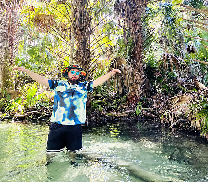 Pure joy looks exactly like this: arms outstretched in crystal waters, surrounded by palms, without a single email notification in sight.