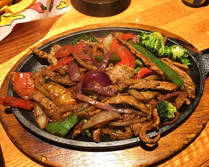 Traditional steak fajitas sizzling with the kind of authentic flavors that make geography completely irrelevant to great eating.