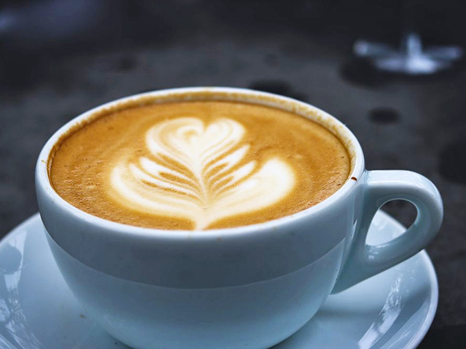 Latte art so perfect it feels almost criminal to disturb it&mdash;though the coffee beneath is too good not to drink.