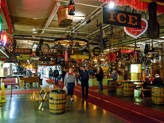 Shoppers navigate a wonderland of vintage signs and barrel seating, where every hanging object tells a story worth the price of admission.