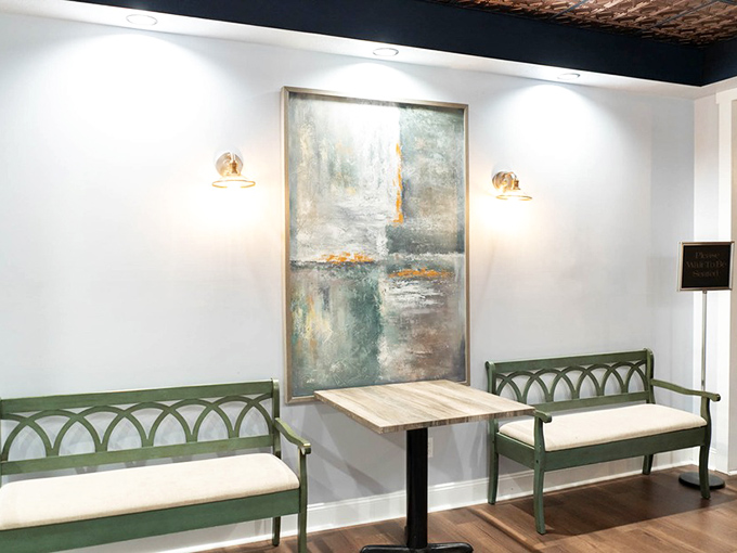 A quiet corner where abstract art meets comfortable seating. The perfect spot to contemplate life's important questions, like "Should I order dessert?"