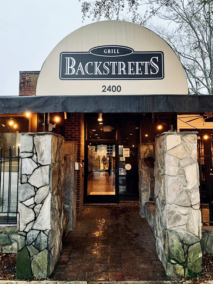 The entrance beckons like a portal to flavor country, those stone pillars standing guard over countless happy meals.