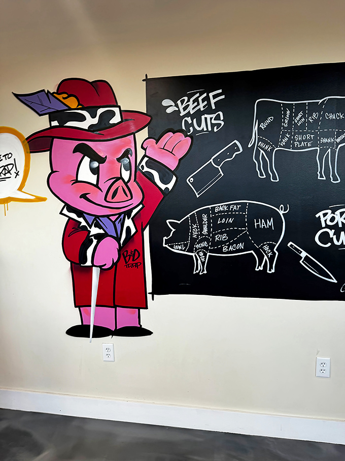 Educational wall art teaches diners about cuts while a cartoon pig mascot adds whimsical charm.