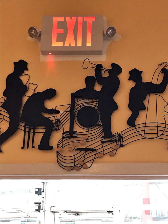 Even the exit signs have style here. These jazz musicians silhouettes remind you that good BBQ, like good music, is an art form.