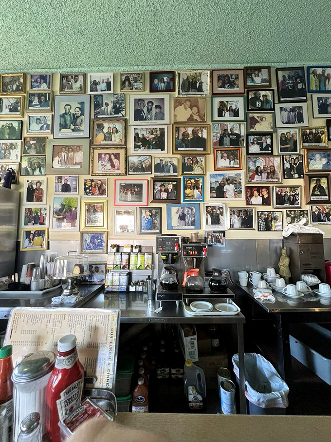The wall of photographs isn't decoration—it's a community archive, documenting decades of Oakland history one meal at a time.
