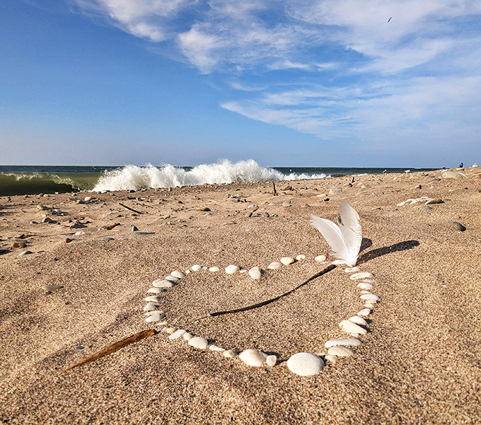 Mother Nature's perfect wave crashes onto shore, leaving behind a heart made of shells&mdash;even the lake knows this place is lovable.