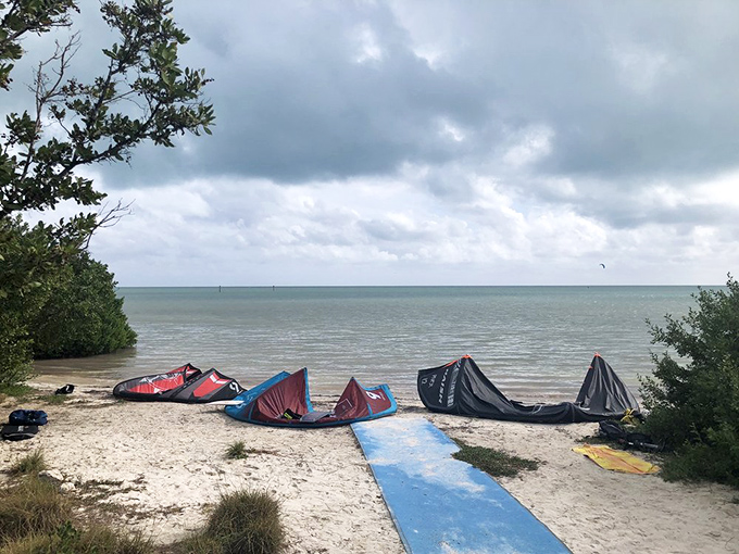 Kiteboarders' staging ground: where colorful equipment waits patiently for wind and adventurous souls brave enough to harness it.