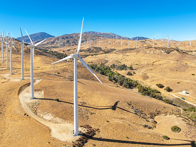 Tehachapi's wind turbines stand like modern-day giants, harvesting mountain breezes while creating a landscape that's equal parts sci-fi and sustainable future.