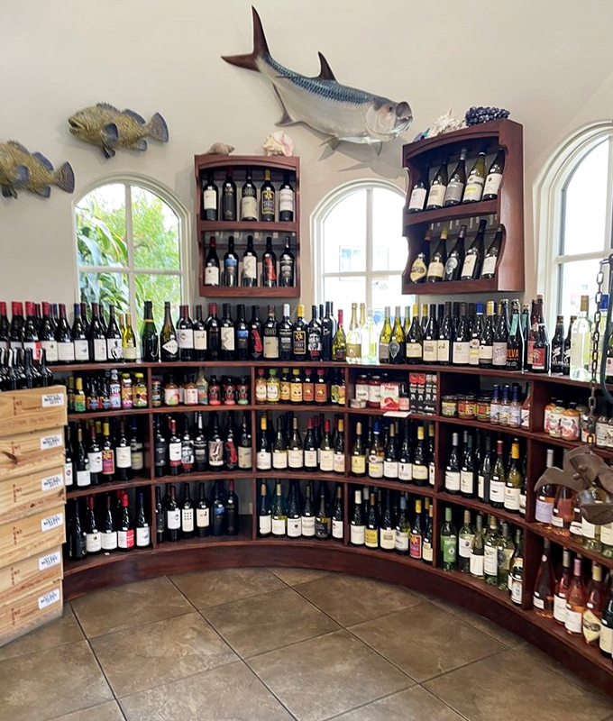 Wine selection that would make any sommelier nod in approval. Fish have their perfect liquid partners waiting right here on these shelves.