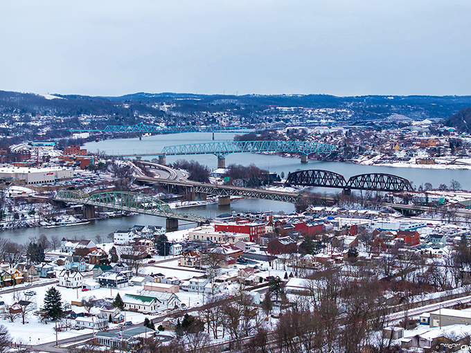 Winter blankets Beaver in pristine white, transforming the river valley into a snow globe scene where bridges stand like steadfast sentinels against the cold.
