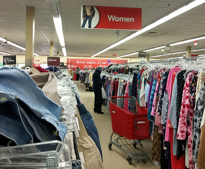 Women's clothing stretches to the horizon, organized by color to create a rainbow effect that's both practical and oddly beautiful.