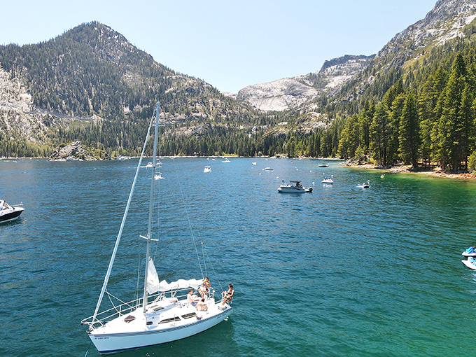Sailboats dot the bay like elegant water birds, their white sails catching mountain breezes while passengers catch unforgettable views.