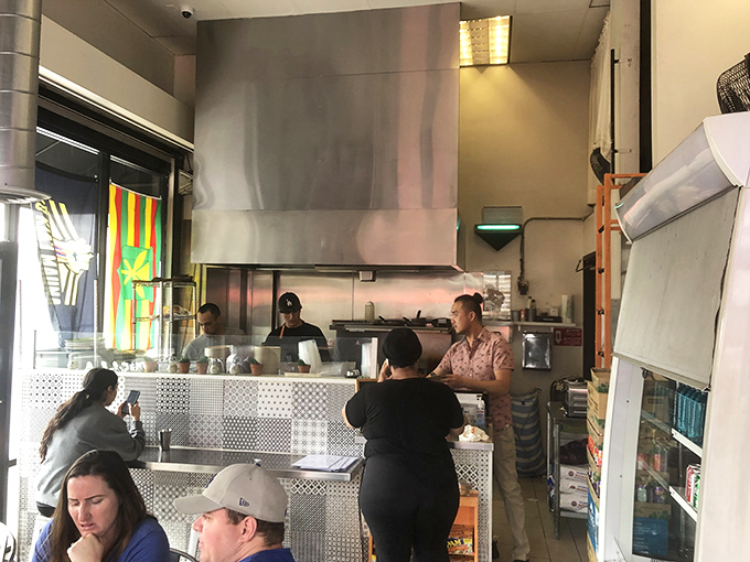 Where the magic happens—a bustling kitchen turning out plate after plate of cross-cultural comfort food that keeps the line stretching out the door.