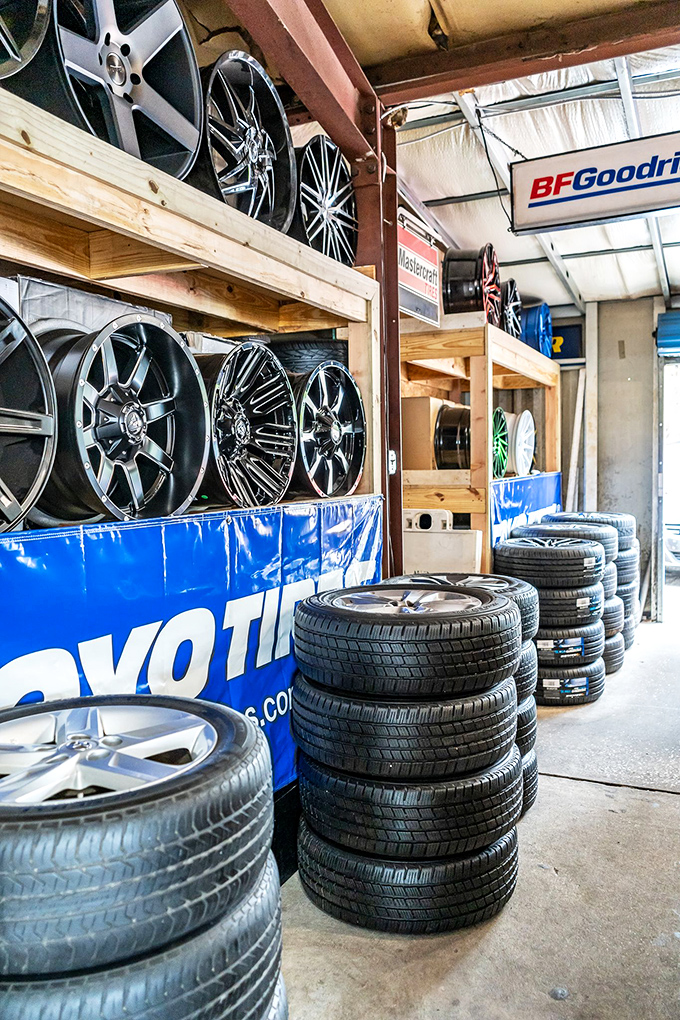 Wheels and tires stacked like industrial layer cakes. Car enthusiasts know: sometimes the perfect set of rims is all that stands between ordinary and extraordinary.