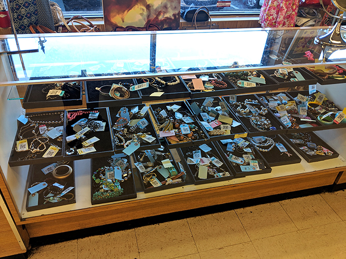 Jewelry displayed like archaeological findings from the not-so-distant past. Vintage brooches and contemporary beads living in perfect harmony.