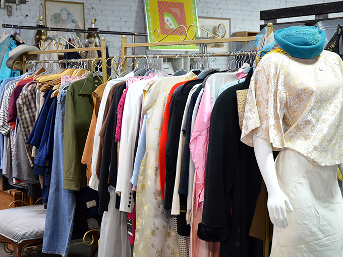 Vintage clothing racks where yesterday's fashion becomes tomorrow's statement piece. That turquoise hat is practically screaming for attention.