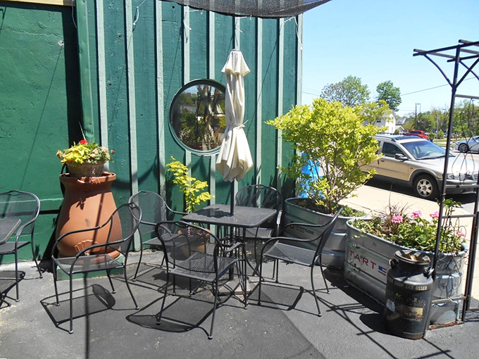 The patio setup proves good things come in small packages&mdash;intimate seating surrounded by greenery creates an urban oasis.