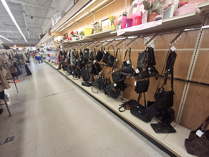 Handbag heaven! Purses and totes hang in orderly rows, each one hoping you'll be the next shoulder they call home.