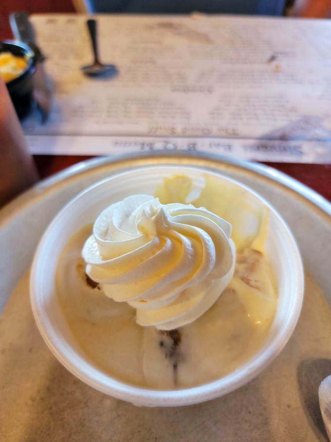 Banana pudding topped with a cloud of whipped cream—the dessert equivalent of a warm Southern hug.