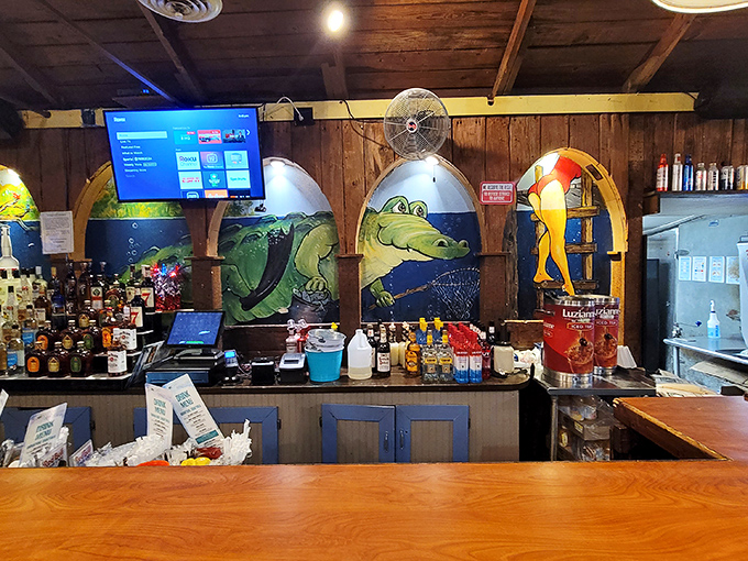 The bar where stories get better with each telling – colorful murals of gators remind you exactly where in the world you've landed.