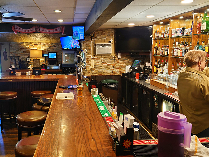 The bar area &ndash; where strangers become friends over stories and spirits. That wooden bartop has heard more Maryland tales than a history professor.