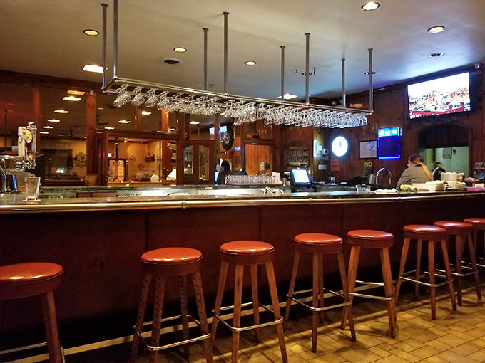 A bar where everybody might not know your name yet, but they'll remember your drink. Those hanging glasses promise sophisticated evenings ahead.