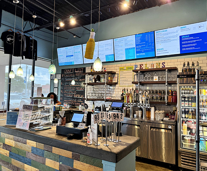 Modern meets coastal at this stylish bar area where subway tiles, pendant lights, and digital menus create an atmosphere that's both hip and welcoming.