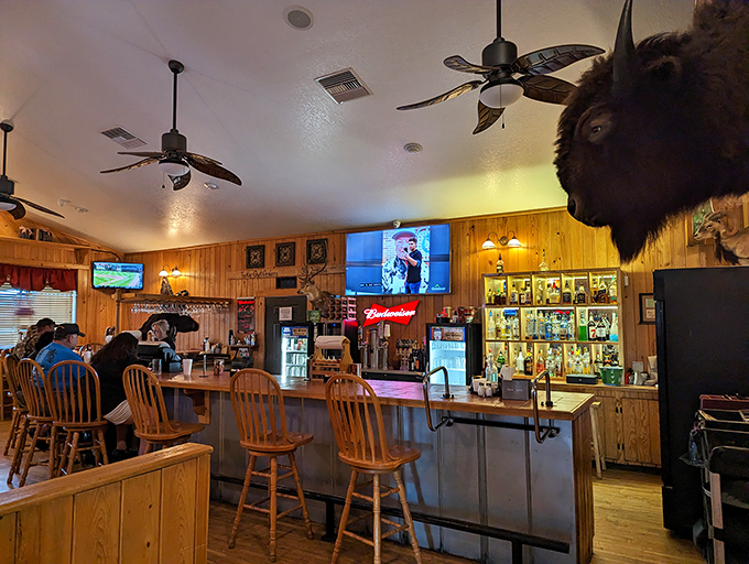 The bar where hunting stories get better with each round. That buffalo head has heard it all and keeps the secrets of Live Oak's most enthusiastic carnivores.