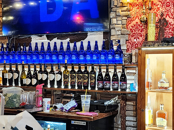 The bar area doesn't just serve drinks&mdash;it serves possibilities. Those blue bottles lined up like soldiers are ready for duty in your evening's adventures