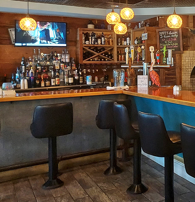 The bar area&mdash;where strangers become friends and "just one more" becomes the motto of the evening. Those pendant lights cast the perfect glow.