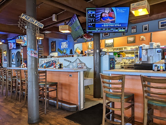 The bar area where locals gather to debate the finer points of oyster shucking techniques.