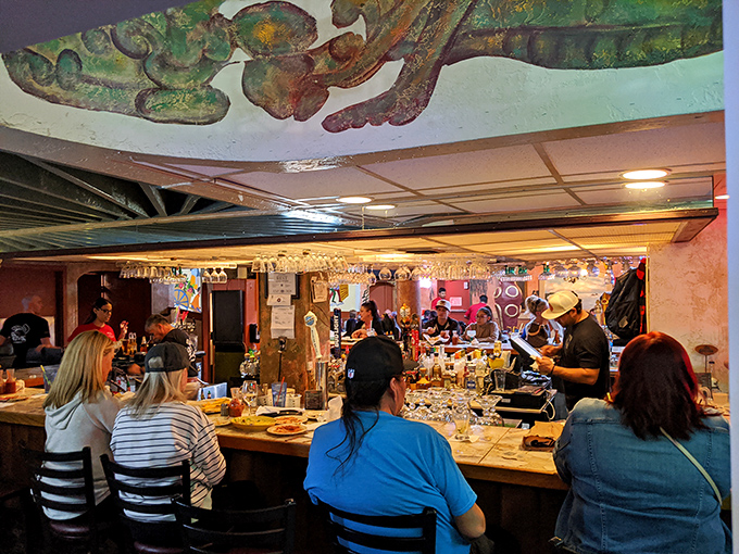 The bar at Los Olivos isn't just serving drinks; it's dispensing liquid sunshine and conversation in equal measure.