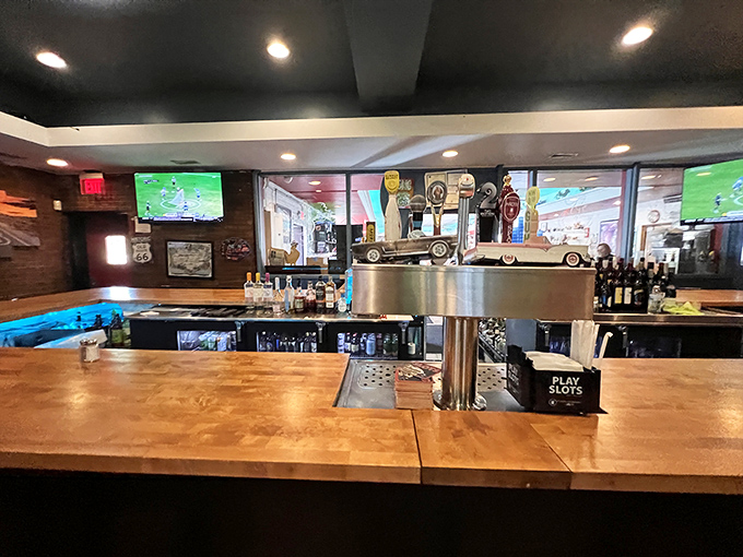 The bar area where strangers become friends over chicken stories and cold drinks &ndash; like Cheers, but with better food and Route 66 memorabilia.
