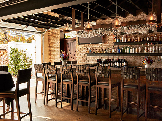 The bar area combines rustic charm with sophisticated service&mdash;where strangers become friends over perfectly poured drinks and shared food recommendations.