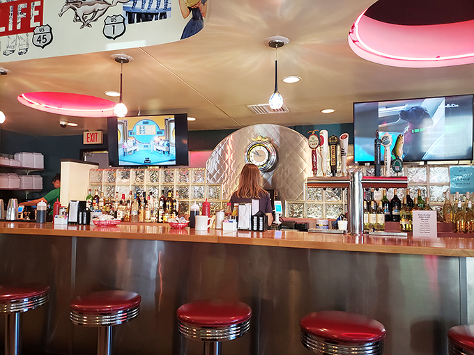 The bar where milkshakes meet martinis under the glow of red neon. Those stools have supported generations of hungry Virginians seeking liquid comfort.