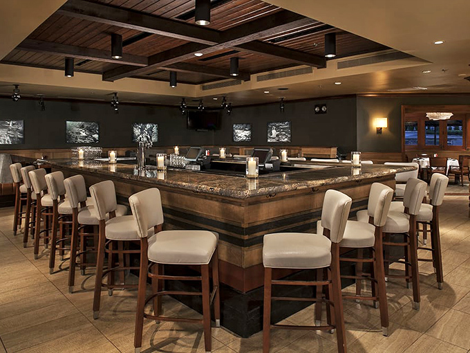 The horseshoe-shaped bar creates the perfect spot for both intimate conversations and people-watching entertainment.
