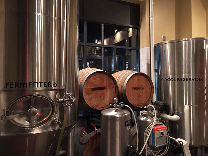 Behind the scenes where the magic happens. These tanks and barrels aren't just equipment&mdash;they're the laboratory where liquid happiness is created.