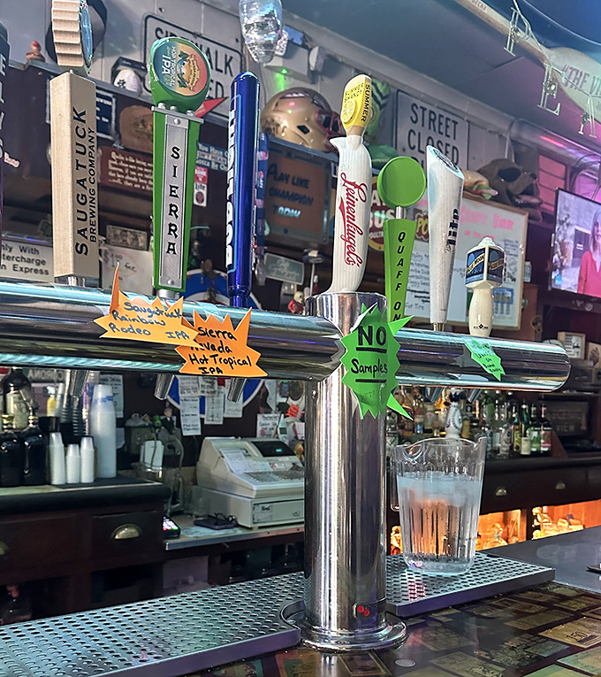 Beer taps standing at attention like soldiers guarding liquid happiness. The "No Samples" sign suggests they're tired of commitment-phobes.