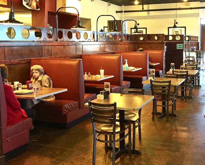 Classic red booth seating where countless stories have been shared over plates of home-style cooking.