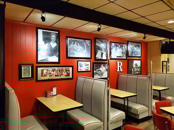 Red booths lined with history&mdash;where every black and white photo tells a story of the family legacy behind each perfect pizza cut.