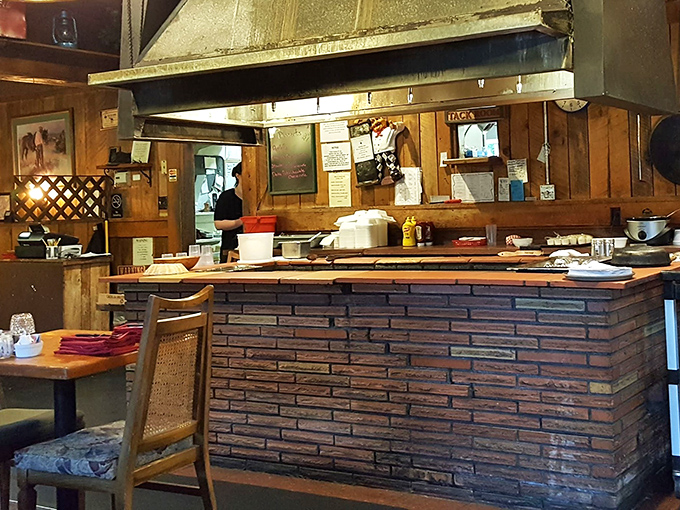 The brick grill station&mdash;command central for meat mastery. Some chefs have offices, these folks have fire and iron.