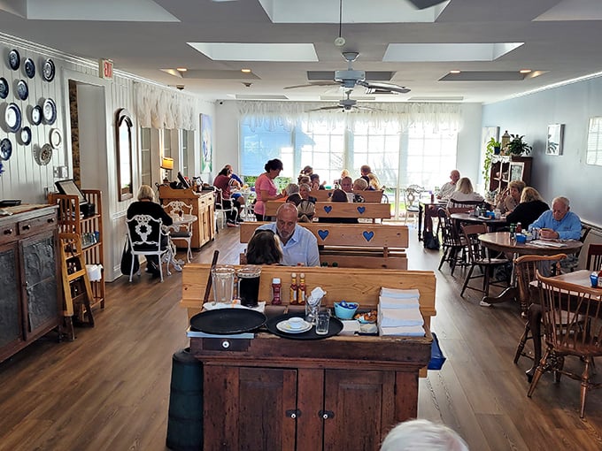 The dining room hums with the universal language of satisfied customers. Notice how nobody's looking at their phones? That's breakfast magic.