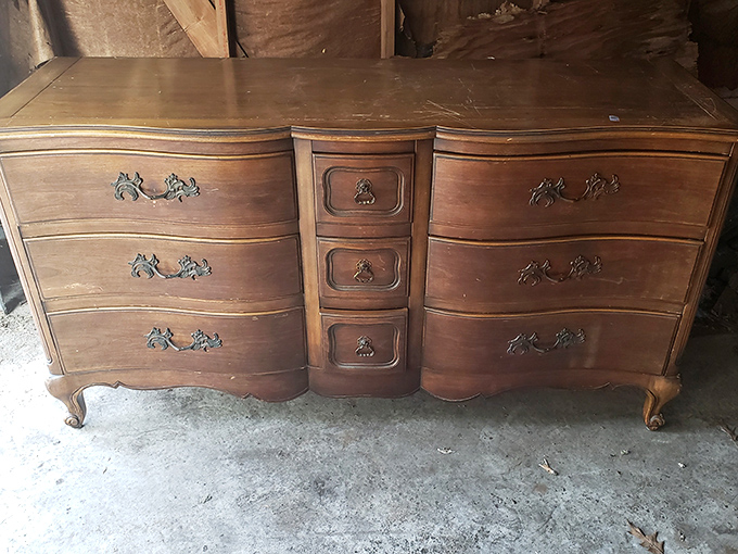 This French Provincial dresser has stories to tell. With those curved drawers and ornate handles, it's waiting for its second act.