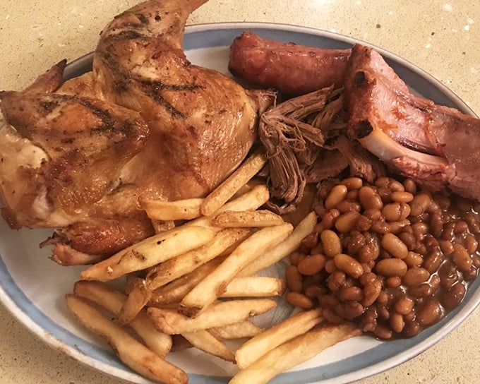 A plate that doesn't know the meaning of restraint. Chicken, ribs, beans, and fries&mdash;this isn't a meal, it's a declaration that today is special.